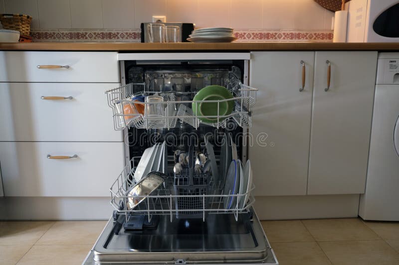 Modern Kitchen with Open Dishwasher Loaded with Clean Dishes and ...