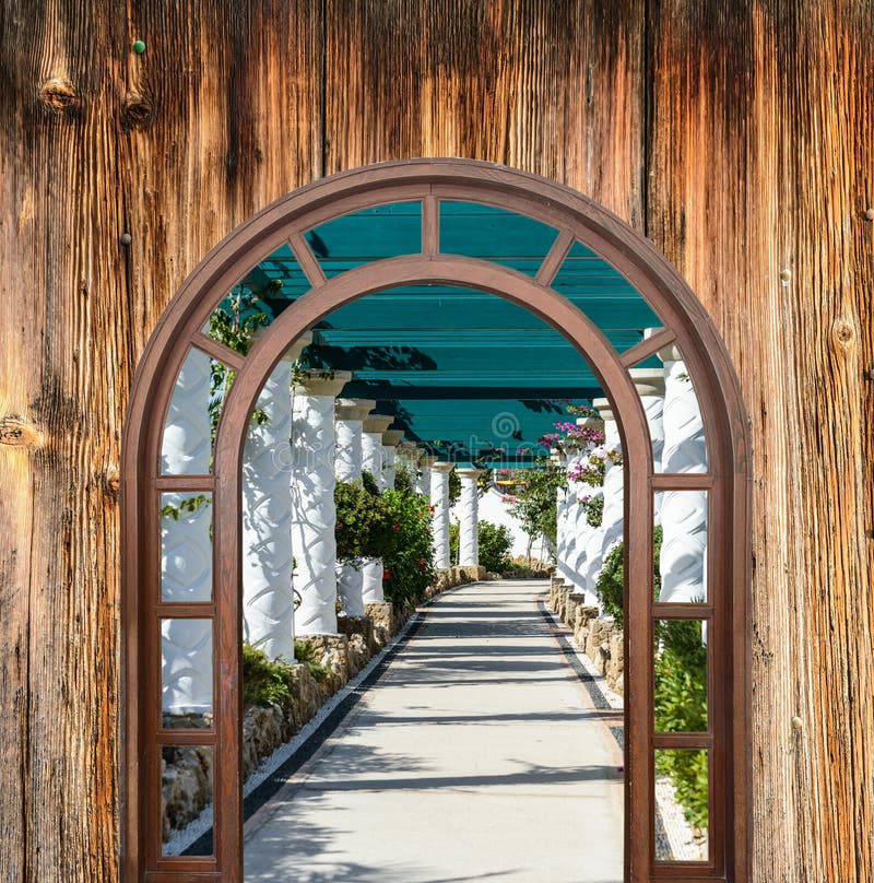 Open Door Arch with Access To Alley Stock Image - Image of plant ...
