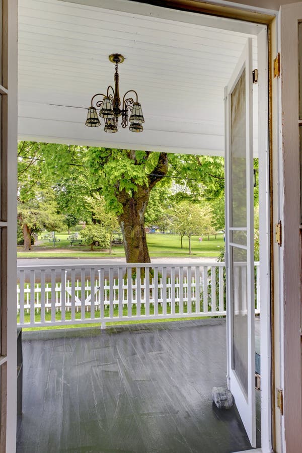 Open Door To the Front Porch with View of the Park. Stock Image - Image ...