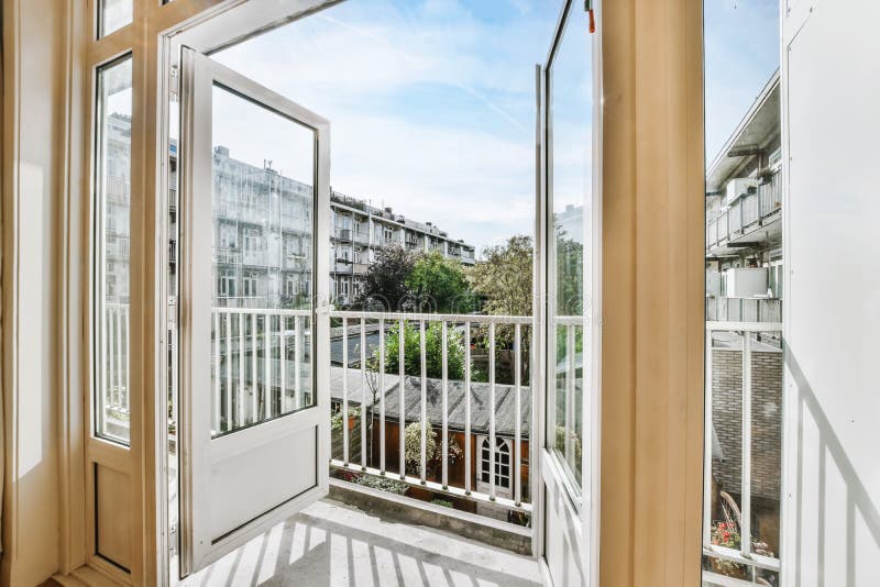 Open Doors Leading To a Balcony Stock Photo - Image of elegant, comfort ...