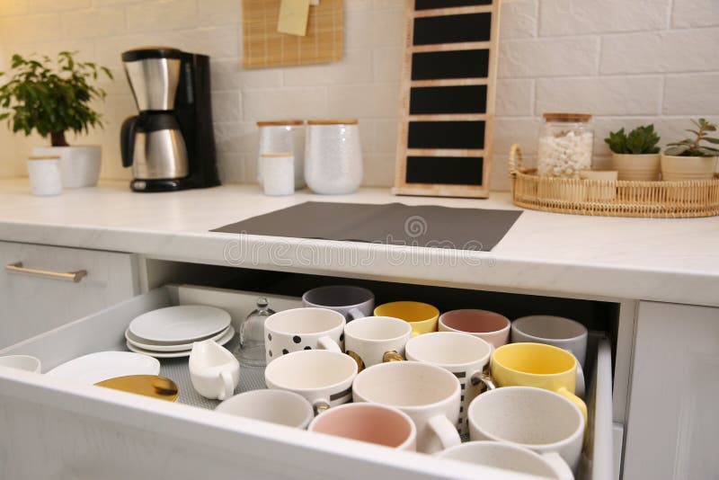 Drawer with Cups and Coffeemaker on Countertop in Kitchen Stock Photo ...