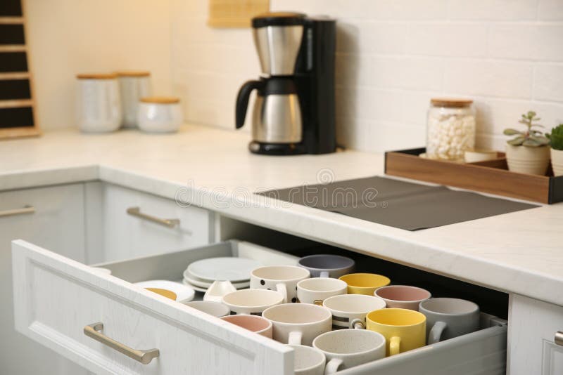 Drawer with Cups and Coffeemaker on Countertop in Kitchen Stock Photo ...