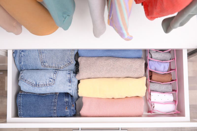 Open Drawer with Folded Clothes Indoors, Top View. Vertical Storage ...