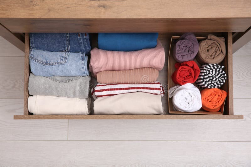 Open Drawer with Folded Clothes Indoors, Top View. Vertical Storage ...