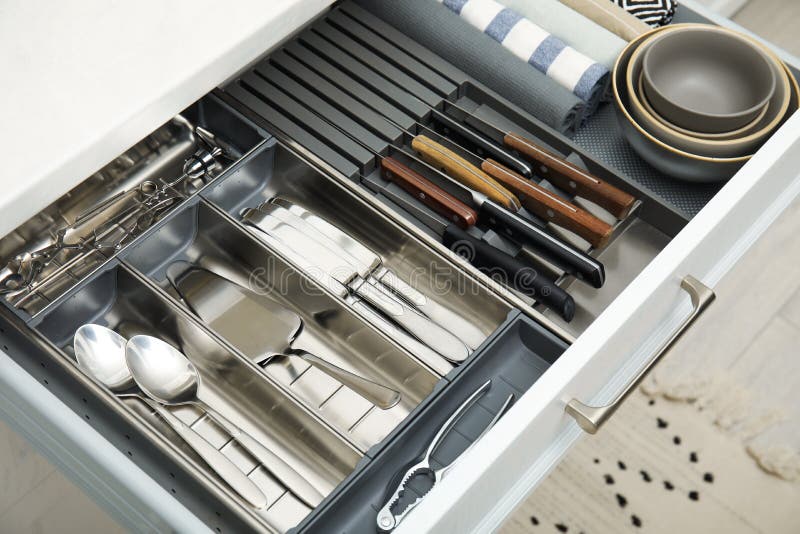 Open Drawer of Kitchen Cabinet with Different Utensils, Dishware and ...