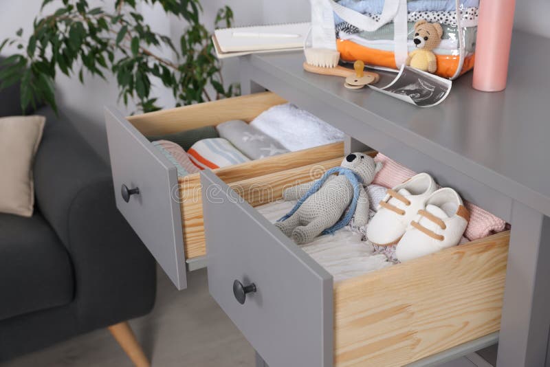 Open Drawers of Chest with Baby Stuff in Room Stock Photo - Image of ...
