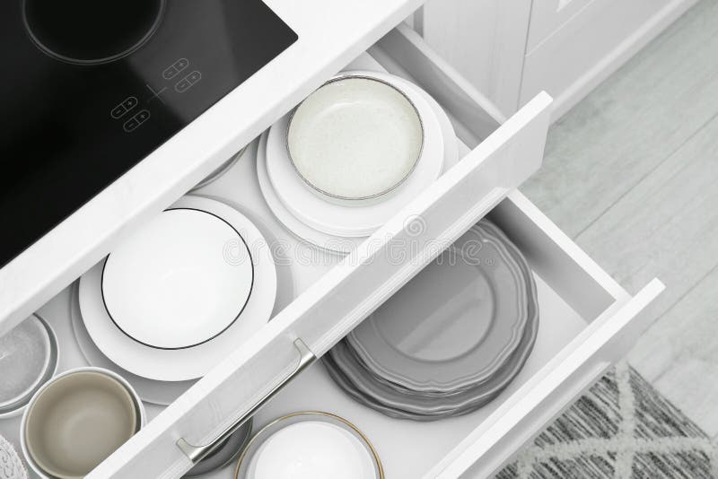 Open Drawers with Different Plates and Bowls in Kitchen, Above View ...