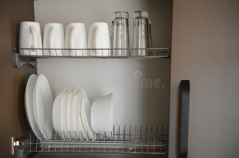 Open Drawers with Different Plates and Bowls in Kitchen, Closeup Stock ...