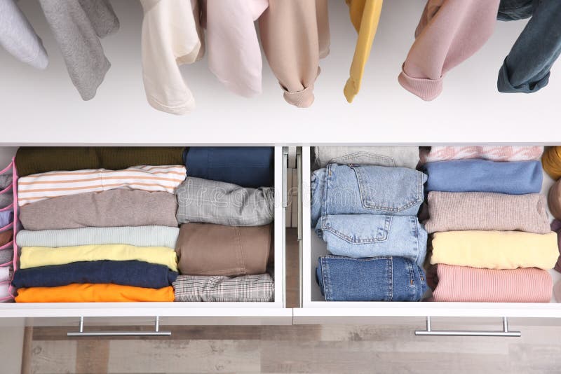 Open Drawers with Folded Clothes Indoors, Top View. Vertical Storage ...