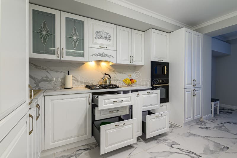 Open Drawers with Kitchenware at Modern White Kitchen Stock Image ...