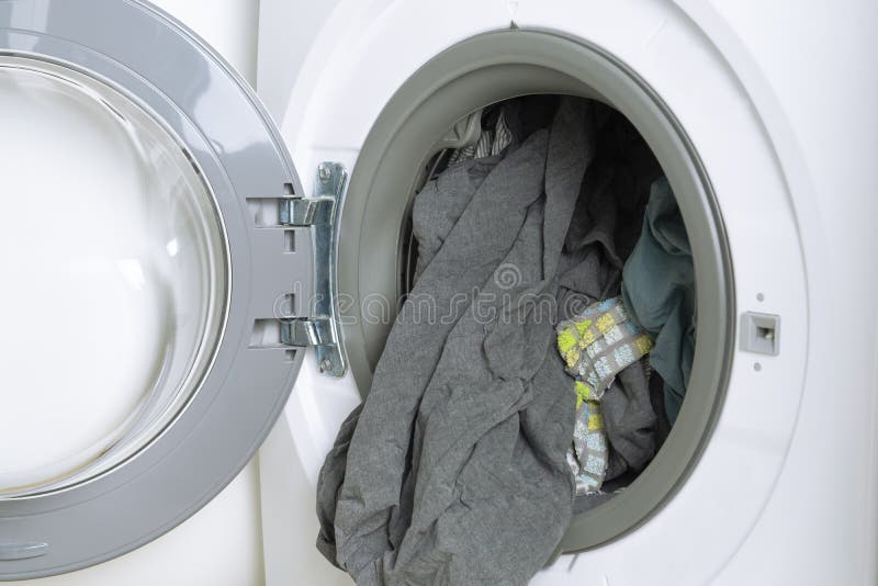 Open Drum of Washing Machine with Clean Laundry Stock Photo - Image of ...