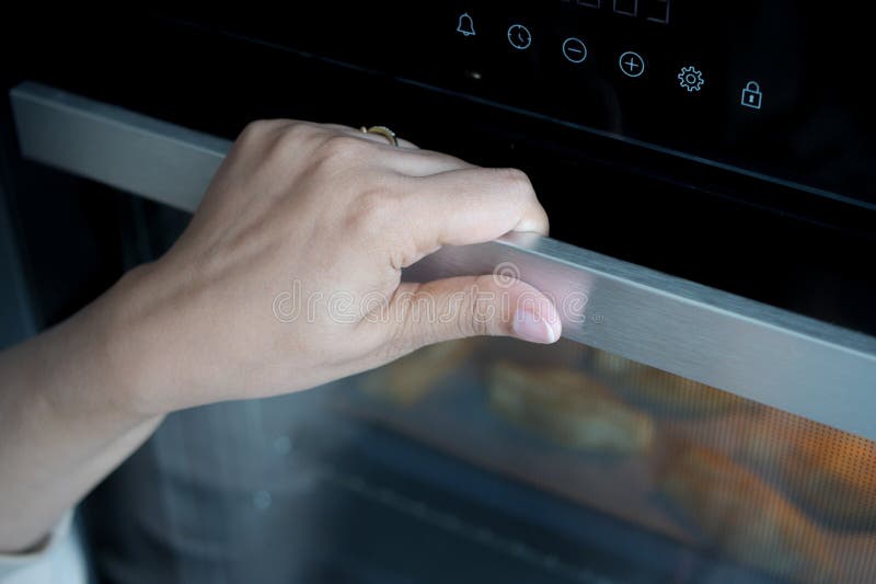 Women Hand Open Electric Oven at Home Stock Photo - Image of ...