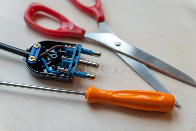 Electric Plug, Screwdriver and Scissors Stock Photo - Image of wood ...