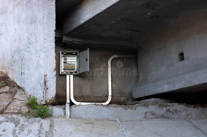 An Open Electrical Panel on the Concrete Wall Under the Bridge. Stock ...