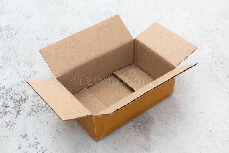Open Empty Brown Cardboard Box on Concrete Floor Stock Image - Image of ...