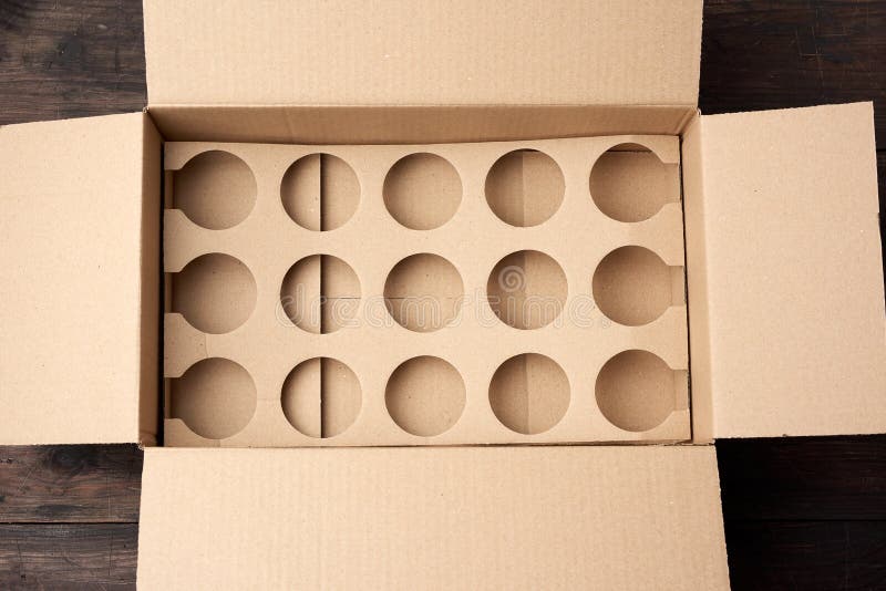 Open Empty Brown Cardboard Box with Round Cells for Cans Stock Photo ...