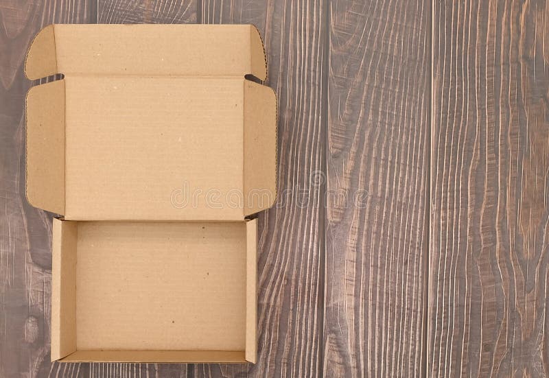 Open Empty Craft Box on a Wooden Surface. Packaging for Products and ...