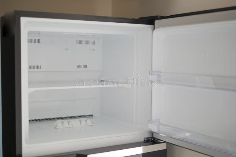 Open empty fridge at home stock photo. Image of domestic - 300896362