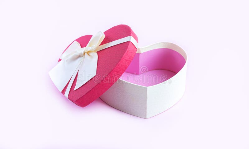 Open Empty Heart Shape Gift Box with Ribbon Bow on Pink Table Stock ...