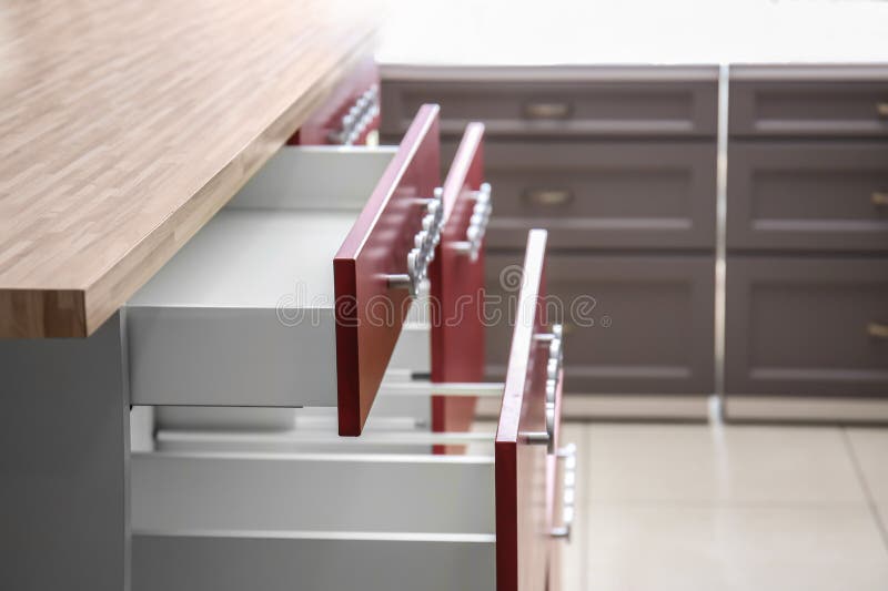 Open empty kitchen drawers stock image. Image of dinnerware - 151241073