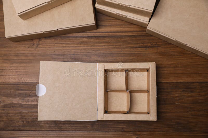 Empty Packaging Box with Dividers on Wooden Table, Top View. Space for ...