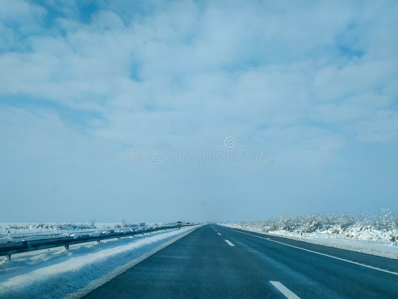 Open Empty Road during Winter Season and Snow on the Side on a Cold Day ...