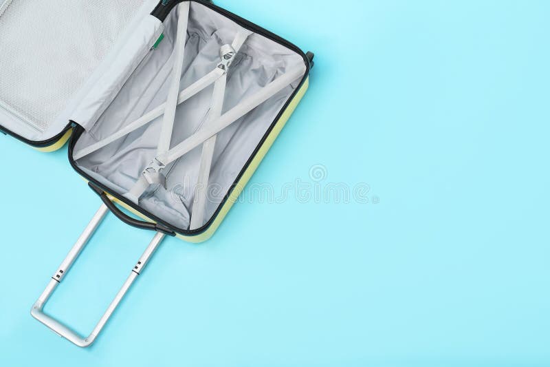Open Empty Suitcase on Light Blue Background, Top View. Space for Text ...