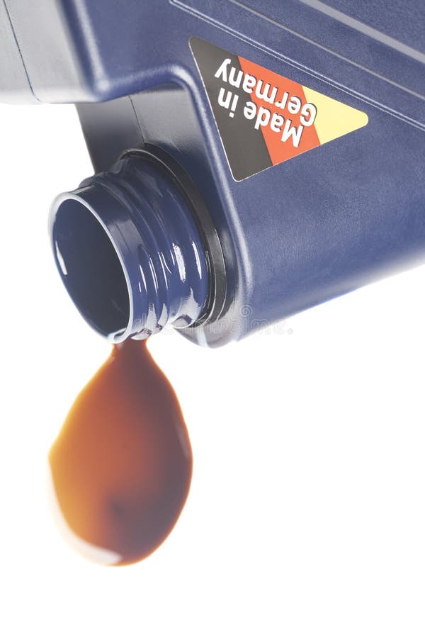 Open Engine Oil Bottle with a Puddle of Engine Oil Isolated on White ...