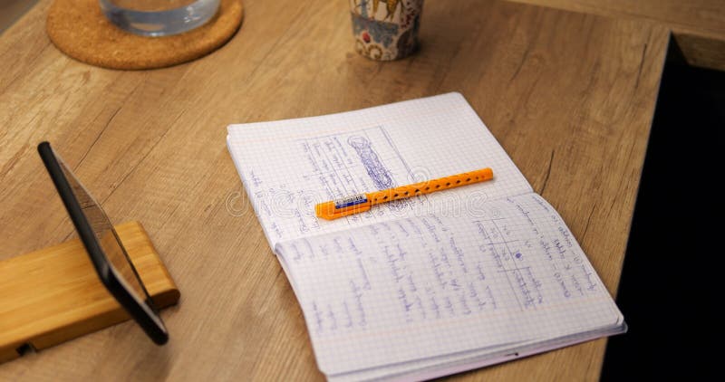 Open Exercise Book with Notes, Pen and Smartphone Lie on Kitchen Desk ...