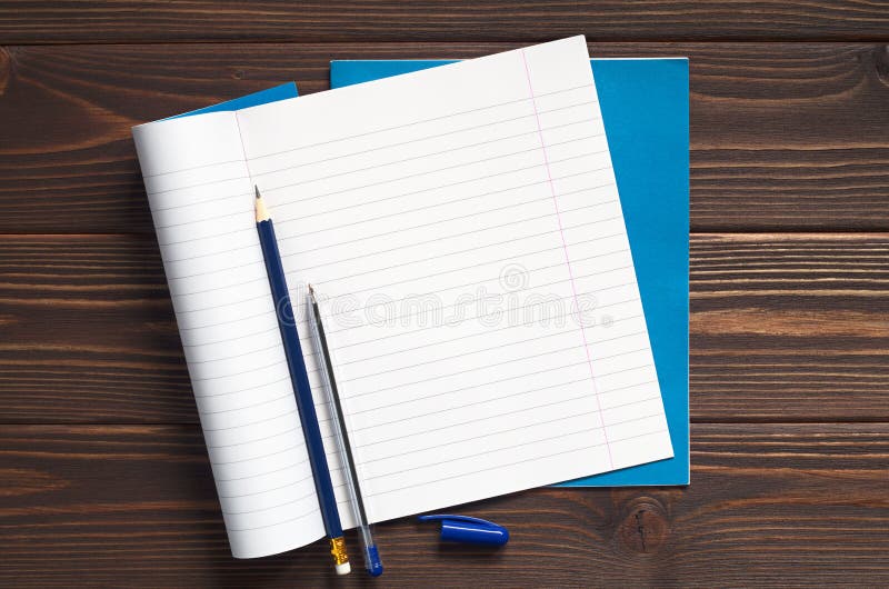 Open Exercise Book on a Stacks of Other Exercise Books Stock Photo ...