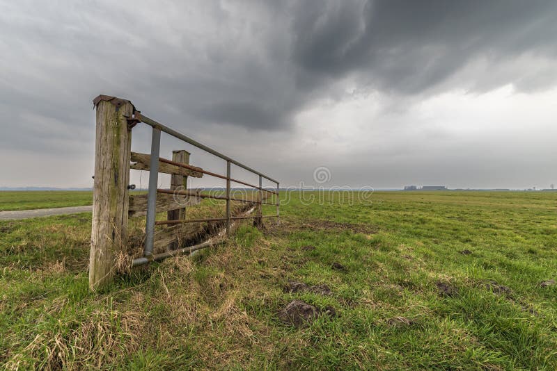 Open Gate on Farmland with Approaching Storm Stock Photo - Image of ...