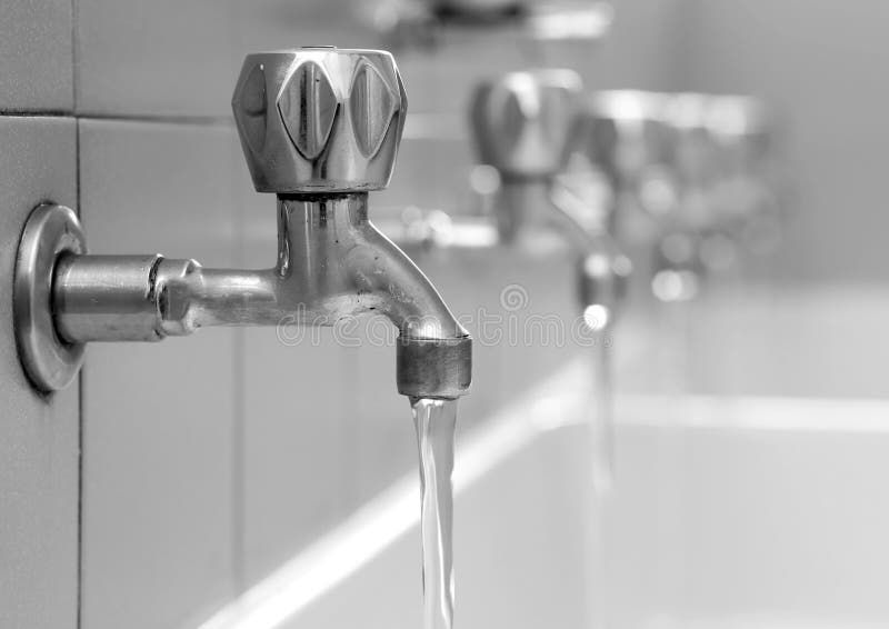 Open Faucets with Water Flowing in the Bath Changing Rooms Stock Photo ...