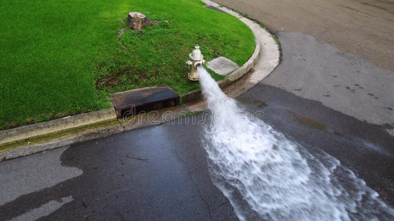 Open Fire Hydrant Flooding Water Onto Street Stock Video - Video of ...