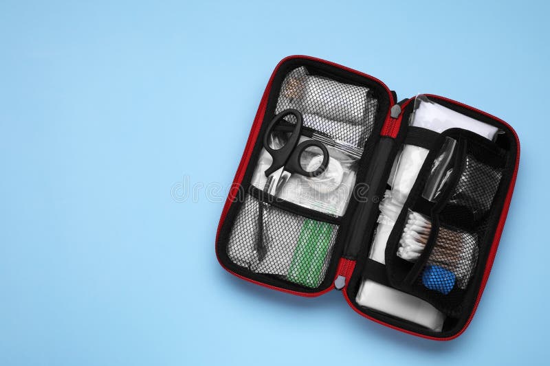 Open First Aid Kit on Light Blue Background, Top View. Space for Text ...