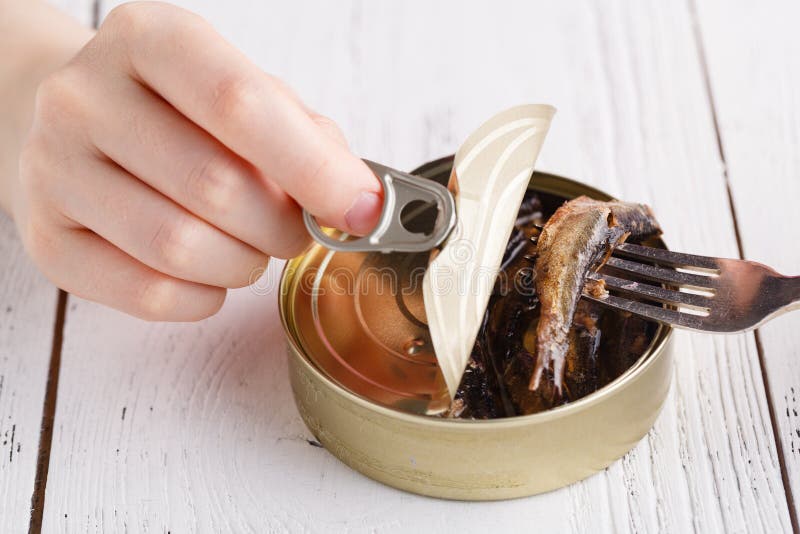 Open Fish Preserves and Fish on the Fork Stock Image - Image of ...