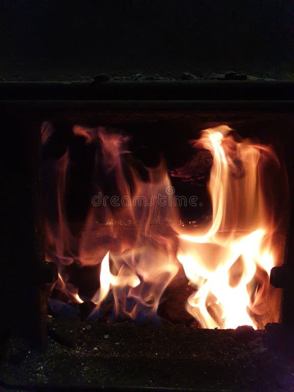 An Open Flame of Fire, Burning Coals in the Fireplace or in a Solid ...
