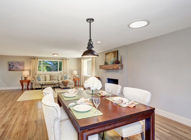 Open Floor Plan Dining Area with Elegant Table Setting and White Soft ...
