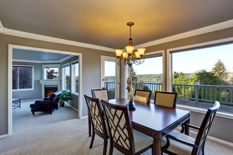 Open Floor Plan Dining Area with Perfect Water View through Windows ...