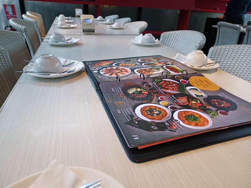 An Open Food Menu is Placed on a White Table. Stock Image - Image of ...