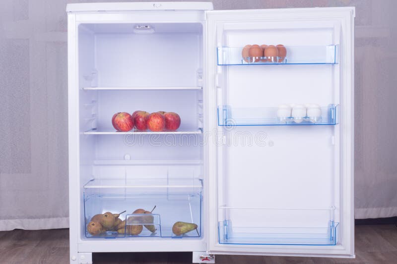 Open Fridge, Eggs, Pears and Apples on the Shelf of Refrigerator Stock ...