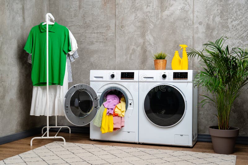 Open Front Loading Washing Machine with Colorful Clothes Stock Photo ...