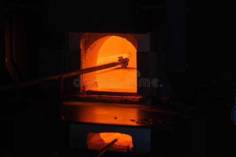 Open Furnace with Molten Glass on a Blowpipe Inside Stock Photo - Image ...