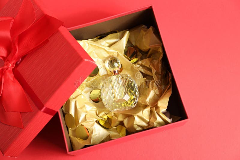 Open Gift Box with Perfume Bottle on Red Background, Top View ...