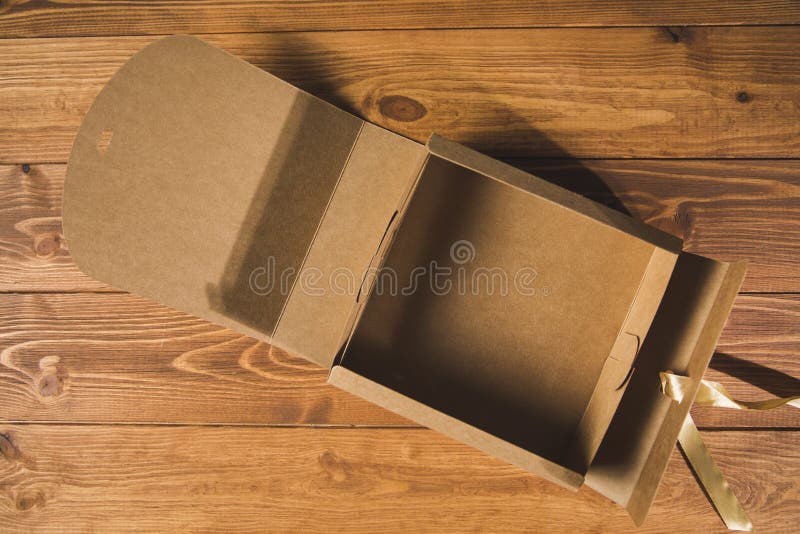 Open gift box on the table stock photo. Image of paper - 217262154