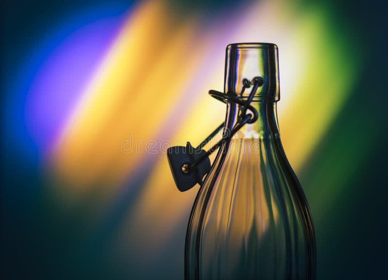 Open Glass Bottle in Front of a Creative Background Stock Photo - Image ...