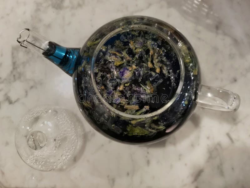 Open Glass Kettle with Blue Tea Inside Stock Photo - Image of ...