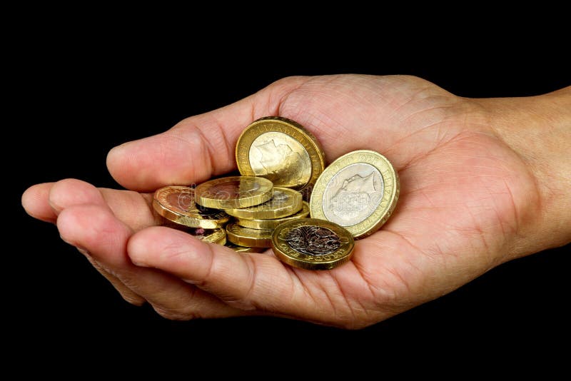Open Hand Holding a Selection of Coins on Black Background Stock Image ...