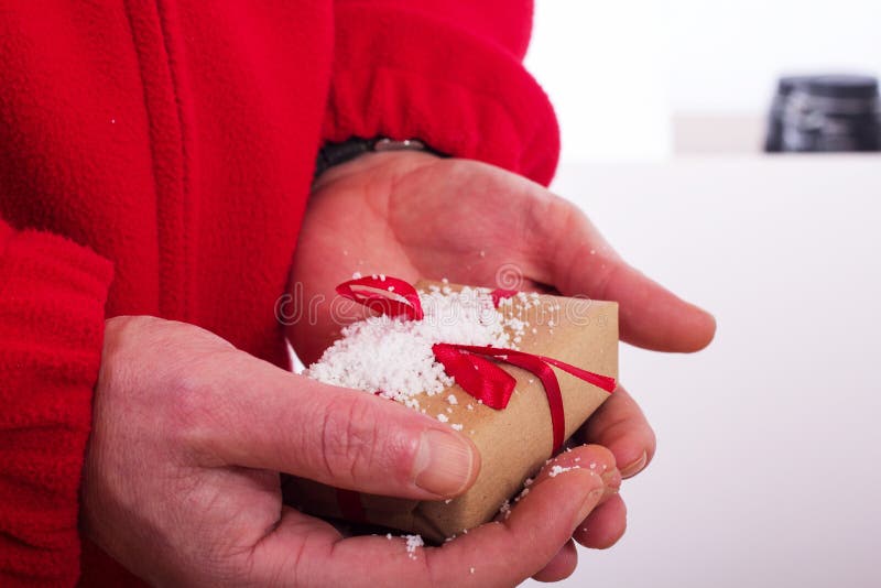 Open Hands Holding a Present Wrapped with a Red Ribbon Stock Photo ...