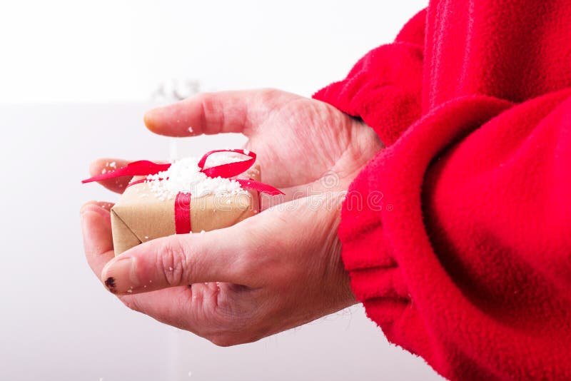 Open Hands Holding a Present Wrapped with a Red Ribbon Stock Image ...