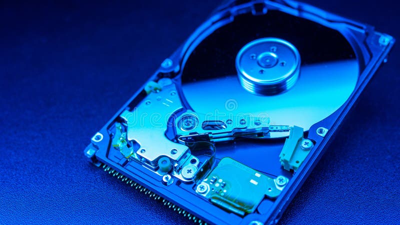An Open Hard Disk Disassembled HDD of a Computer or Laptop Lies on a ...